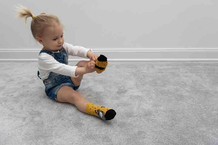 Toddler Putting On Shoes